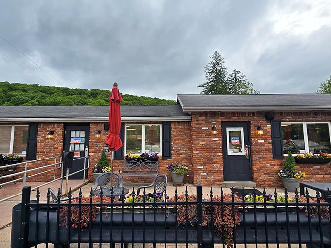 That brick exterior with cheerful red umbrellas is your beacon to pastry paradise in the Pennsylvania hills.