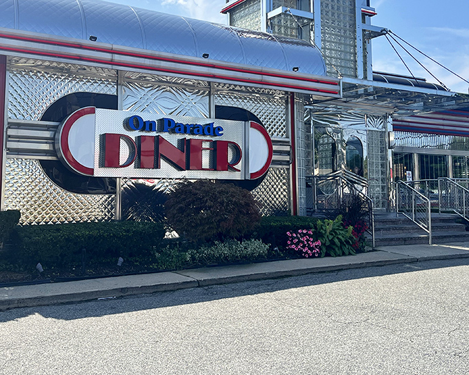 The gleaming chrome exterior of On Parade Diner shines like a beacon of hope for hungry travelers. Classic Americana at its finest.