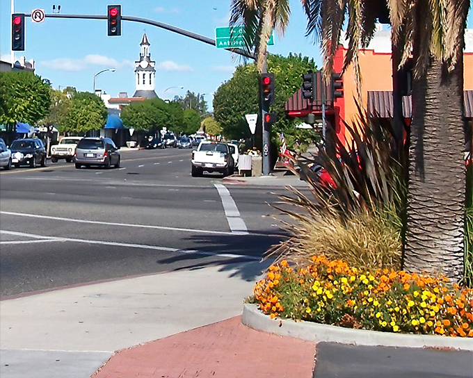 Main Street Red Bluff welcomes visitors with its iconic clock tower peeking through the palms, a small-town skyline that feels like a warm handshake.