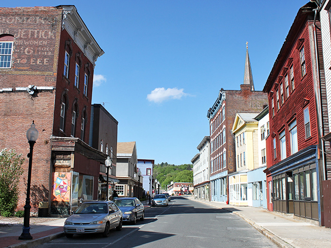 Historic charm meets small-town affordability on North Adams' main street, where colorful facades tell stories of reinvention and possibility.