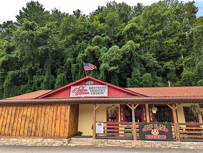 That red barn exterior nestled against the mountain backdrop promises serious comfort food, and those string lights aren't lying.