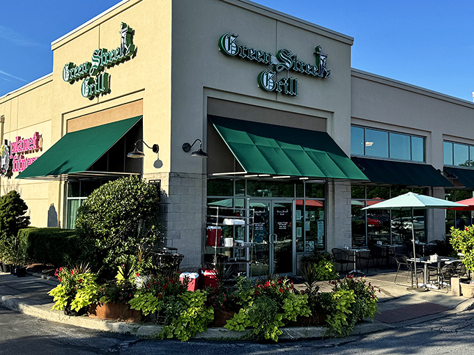 The sunny exterior of Green Street Grill beckons with its distinctive green awnings and colorful flower arrangements. A hidden gem worth the drive to Downingtown.