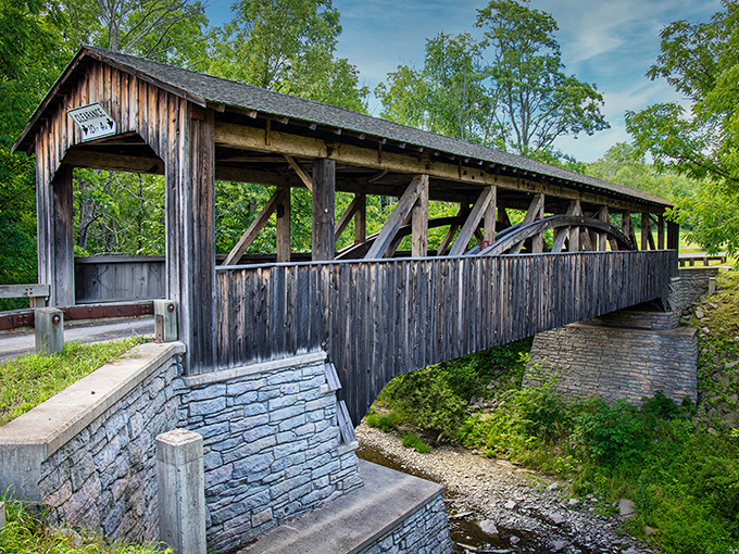 Time stands still at Knapp's Covered Bridge, where weathered wooden beams and stone foundations create a perfect postcard moment in rural Pennsylvania.