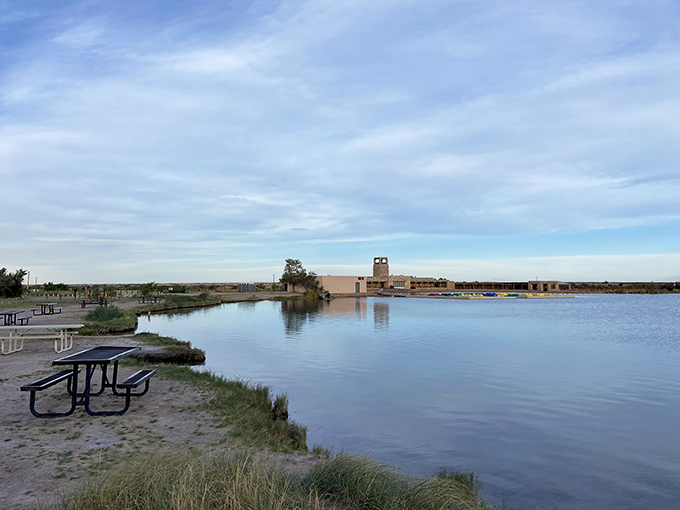 Tranquility perfected: Lea Lake's still waters mirror the sky while picnic tables await your sandwich masterpiece. Nature's dining room with a view.