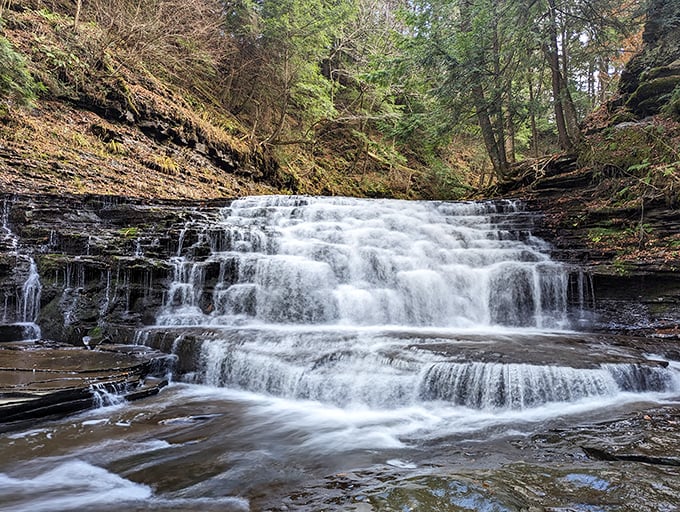 Water dances across layered stone in a hypnotic display that would make even the most dedicated Netflix binger put down the remote.