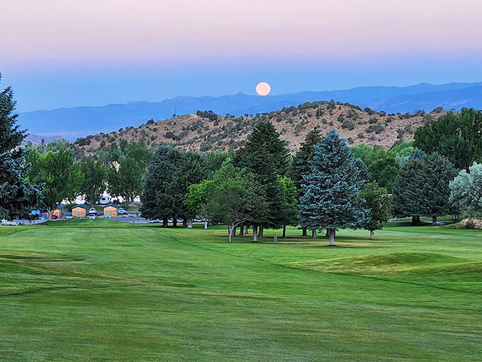 Full moon rising over Palisade's golf course at dusk&mdash;nature's way of saying "I see your sunset and raise you one celestial spectacle."