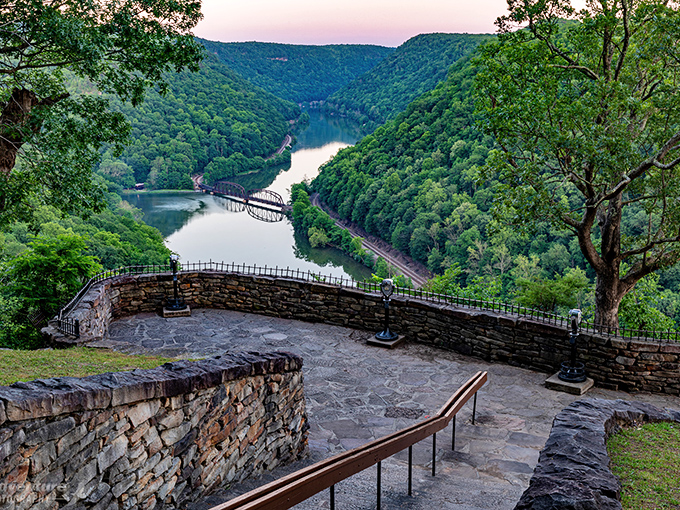 Nature's perfect balcony: The main overlook at Hawks Nest offers a 585-foot-high perch above the New River, where the ancient waterway snakes through mountains like a blue ribbon.