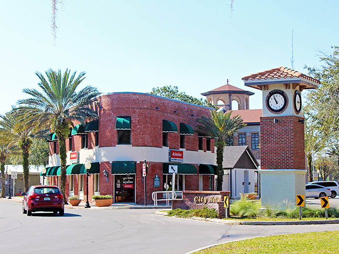 Auburndale's iconic clock tower stands sentinel over brick buildings and palm trees &ndash; small-town Florida charm with a dash of timeless elegance.