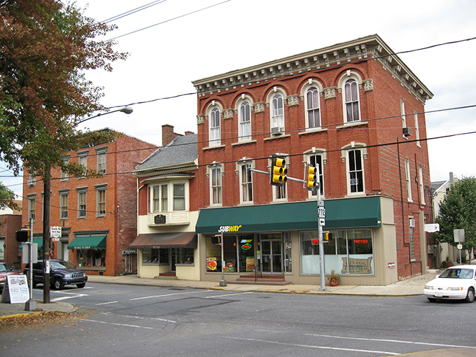 Historic red brick buildings line Manheim's Main Street, where time seems to slow down and modern life takes a backseat to small-town charm.