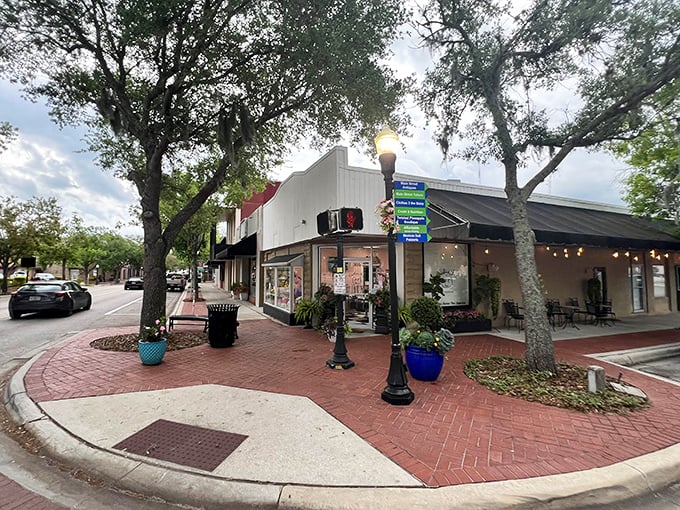 Nestled on a charming brick-paved corner, this bakeshop transforms an ordinary Florida street into a scene worthy of a Hallmark movie.