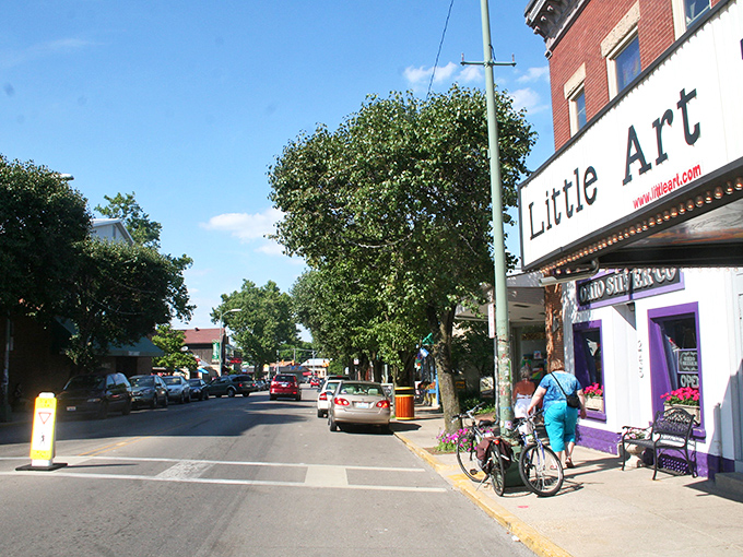 Xenia Avenue welcomes visitors with its small-town charm and colorful storefronts. The Little Art Theatre stands as a cultural beacon in this vibrant community.
