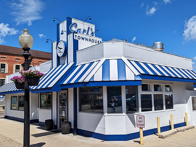 The iconic blue and white exterior of Carl's Townhouse stands like a time capsule in downtown Chillicothe, beckoning hungry travelers with its classic American diner charm.