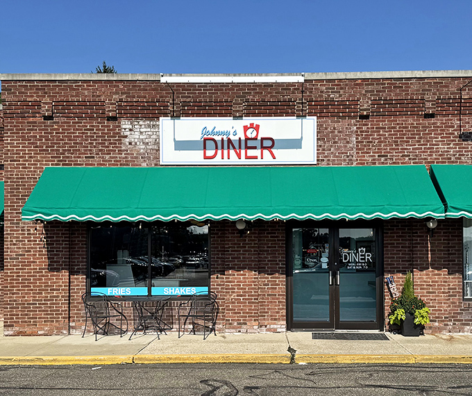 Johnny's Diner welcomes you with its classic brick facade and emerald green awning &ndash; a time capsule of Americana waiting to be discovered.