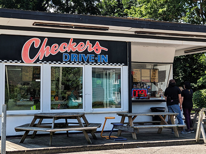 The classic black and white checkered pattern isn't just decoration&mdash;it's a promise that Checkers Drive-In delivers timeless American comfort food without pretension.