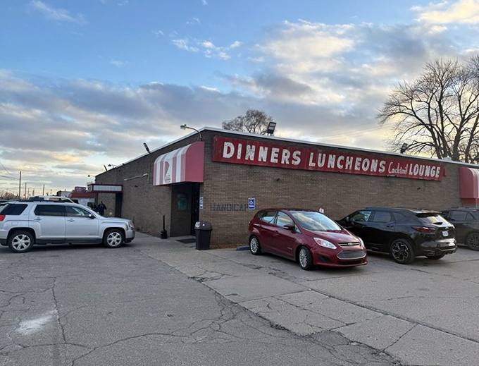 The red and white awning of Loui's Pizza beckons like a lighthouse for the pizza-obsessed. No fancy facade needed when what's inside is this good.