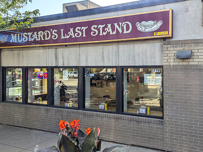 The purple and gold marquee of Mustard's Last Stand stands like a beacon of hope for Chicago dog enthusiasts lost in a sea of kale smoothies.