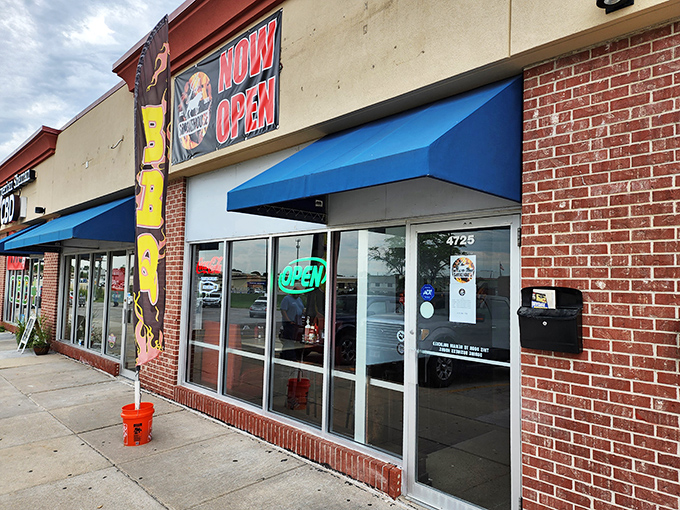 The unassuming storefront might not scream "barbecue paradise," but your nose will know better. Blue awnings and a simple sign&mdash;culinary treasures often hide in plain sight.