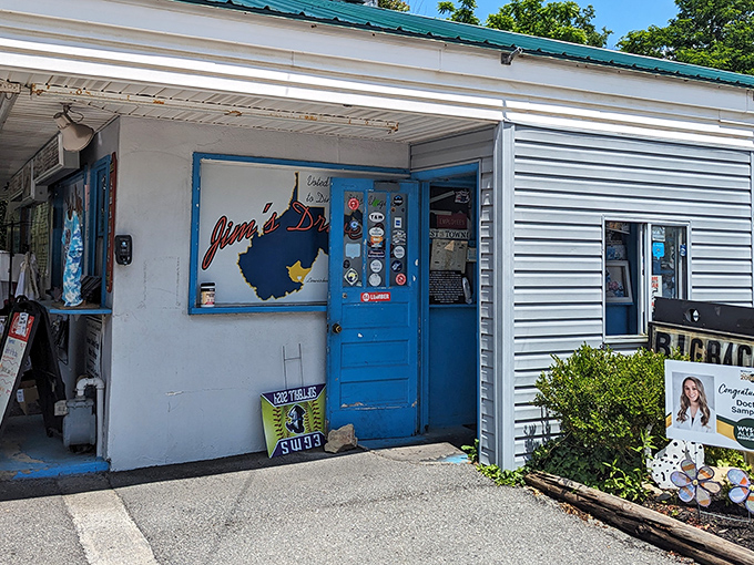 The unassuming white exterior with that iconic blue door is like finding a treasure map where X marks the spot for burger paradise.