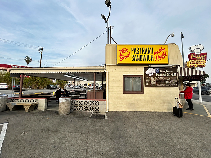 The bright yellow sign boldly proclaims "The Best Pastrami in the World" &ndash; not hyperbole, but a delicious promise kept since 1951.