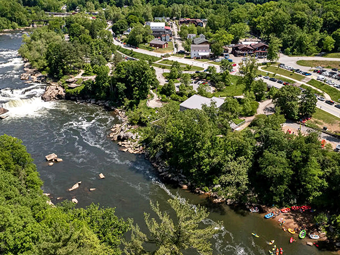 The Youghiogheny River carves its path through Ohiopyle, with colorful kayaks dotting the water like sprinkles on nature's sundae.