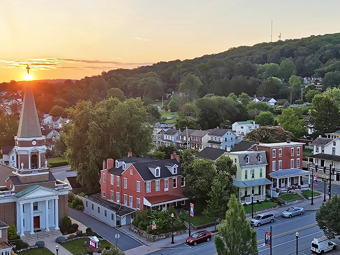 Sunset bathes Ephrata in golden light, where church steeples and historic buildings create a scene straight from a Norman Rockwell painting come to life.