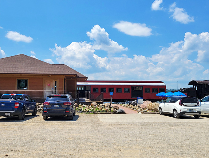 The bright scarlet train car of Buckeye Express Diner stands proudly against the Ohio sky, promising a journey of flavor without ever leaving the station.