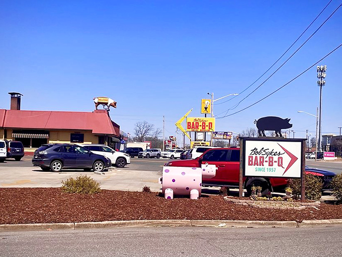 That arrow sign doesn't just point to a restaurant; it directs you toward a Alabama barbecue institution that's been drawing crowds for generations.