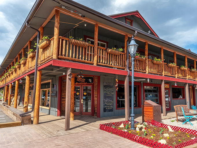 Mountain charm meets barbecue heaven at Sagebrush's inviting exterior, where hanging flower baskets and wooden beams welcome hungry travelers like old friends.