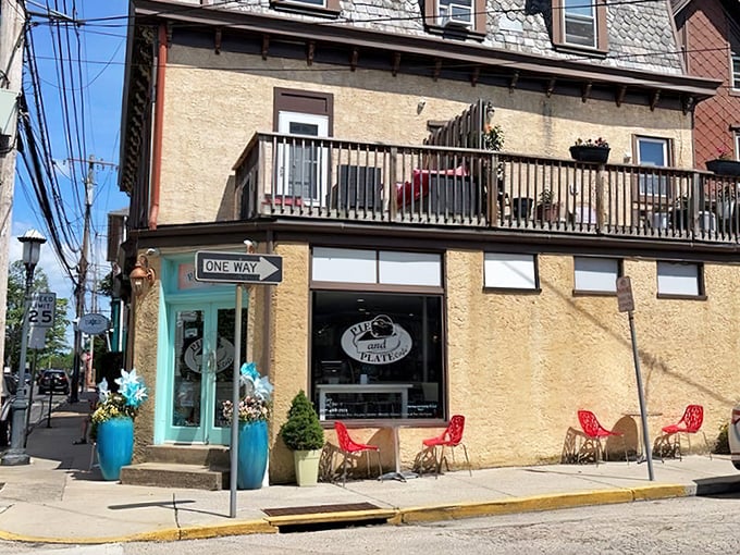 That turquoise door isn't just an entrance&mdash;it's a portal to flaky, buttery happiness disguised as a corner cafe.