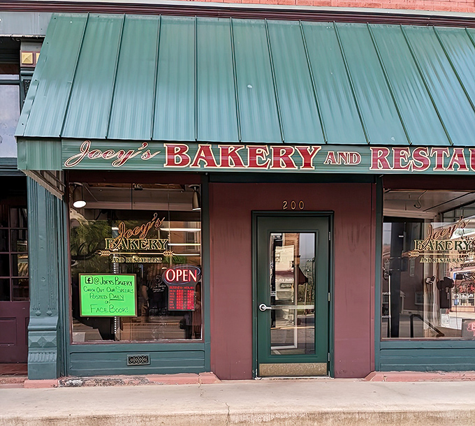 Joey's welcoming storefront promises culinary treasures within, where the green awning serves as a beacon for hungry travelers and locals alike.