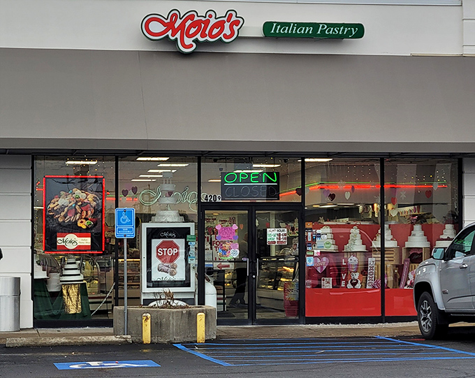 The red cursive sign beckons like an old friend, promising sweet treasures behind those unassuming doors. Italian pastry paradise awaits!