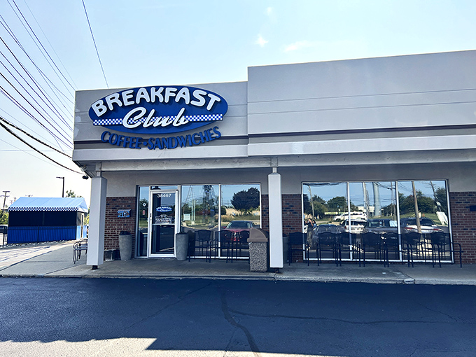 The blue and white sign beckons like a lighthouse for the breakfast-starved. No pretension, just the promise of morning salvation in strip mall form.