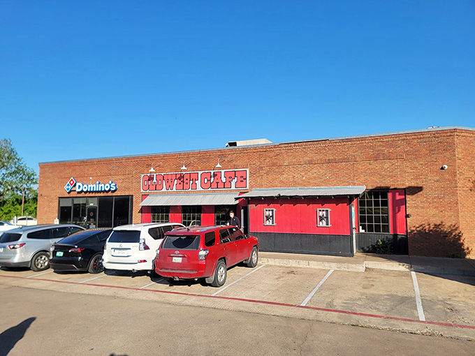 That bold red storefront isn't shy about announcing breakfast paradise, tucked between everyday strip center neighbors like a delicious secret.