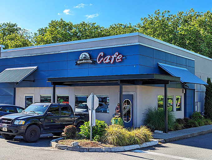 The blue-trimmed exterior of Woodinville Cafe stands like a beacon for breakfast lovers, promising comfort food salvation in Washington wine country.