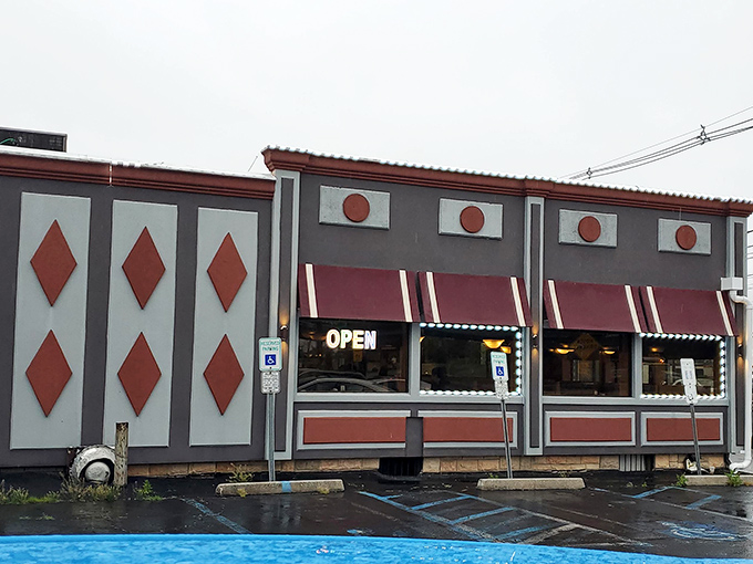 The iconic red diamond exterior of Meadowlands Diner stands like a beacon of comfort food promise in Carlstadt, where hungry souls find salvation.