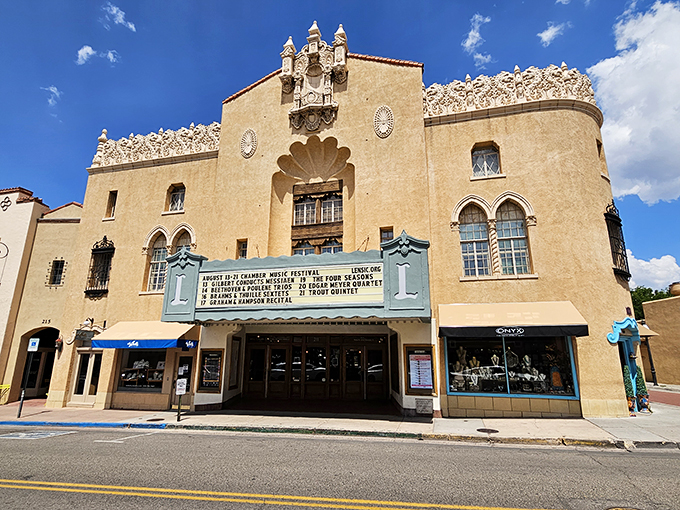 The historic Lensic Theater stands proudly in Santa Fe, showcasing the city's distinctive adobe architecture and cultural heritage. A landmark worth visiting after your breakfast adventure.
