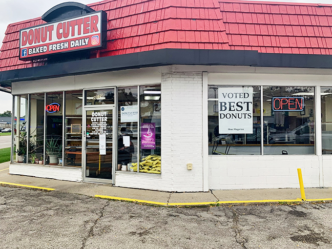 The iconic red-shingled roof of Donut Cutter stands out like a beacon of sugary hope in Berkley. No architectural awards here&mdash;just decades of donut perfection.