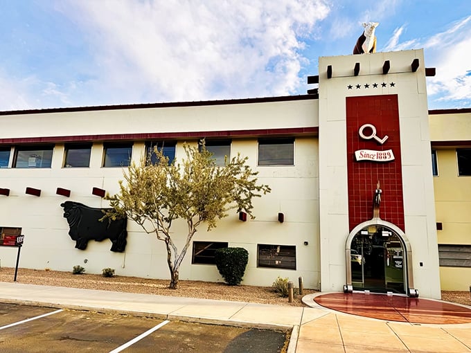 The iconic facade of The Stockyards announces itself with understated Western elegance&mdash;that steer silhouette isn't just decoration, it's a promise.