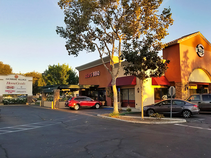 The unassuming exterior of Red's hides in plain sight, like a secret barbecue society waiting for worthy members to discover its smoky treasures.