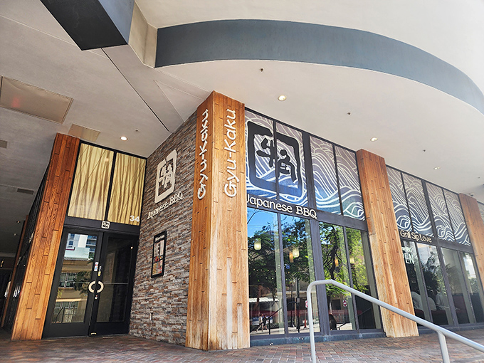 Stone meets wood in this architectural handshake, where Gyu-Kaku's exterior promises a warm embrace of Japanese BBQ delights.