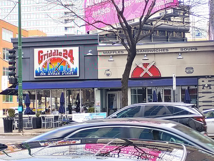 The urban diner of your dreams beckons from the corner of Chicago Avenue, its vibrant sign promising 24-hour comfort in the heart of the city.