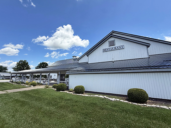 The pristine white exterior of Gasthof stands like a beacon of comfort food against Indiana's blue skies, promising culinary traditions that have stood the test of time.