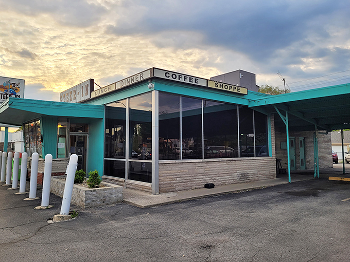 The turquoise time machine! Steer-In's iconic exterior beckons with mid-century charm and the promise of comfort food that's stood the test of time.