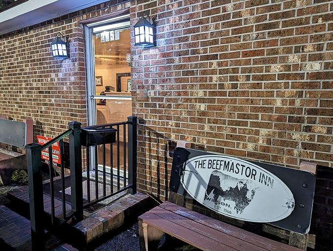 The unassuming entrance tells you everything: this isn't about fancy facades. The real magic happens behind that brick wall and modest sign.