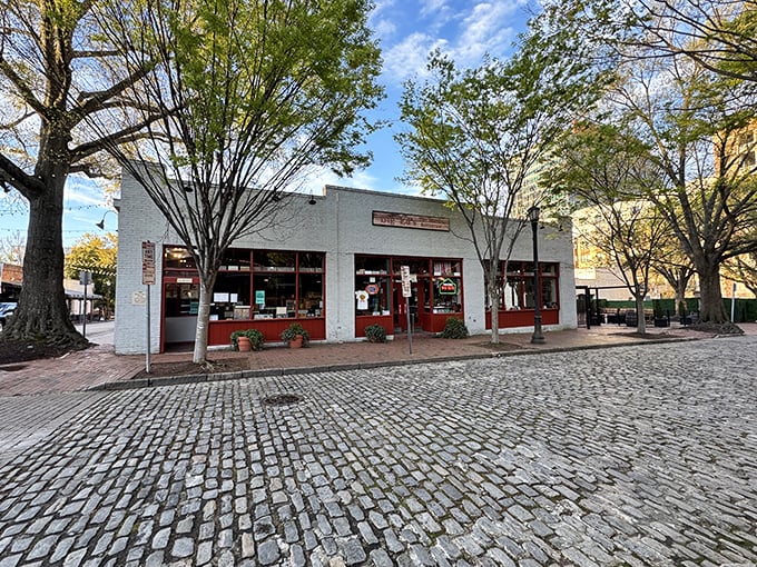 The unassuming white brick exterior of Big Ed's is shaded by charming trees, like a delicious secret hiding in plain sight.