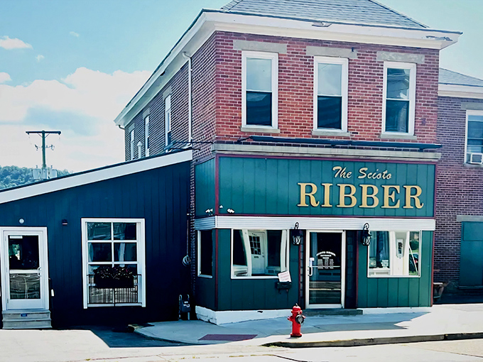 The unassuming brick exterior of Scioto Ribber stands like a culinary speakeasy in Portsmouth&mdash;no flash, just the promise of smoky perfection within.