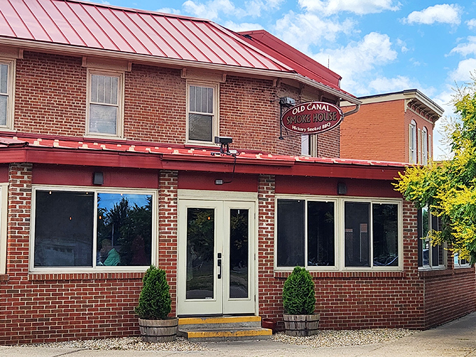 The brick facade and distinctive red roof announce you've arrived at barbecue nirvana, no fancy frills needed.