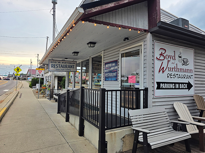 The white clapboard exterior with its green awning isn't trying to impress anyone&mdash;and that's precisely why it does. Classic Americana at its finest.