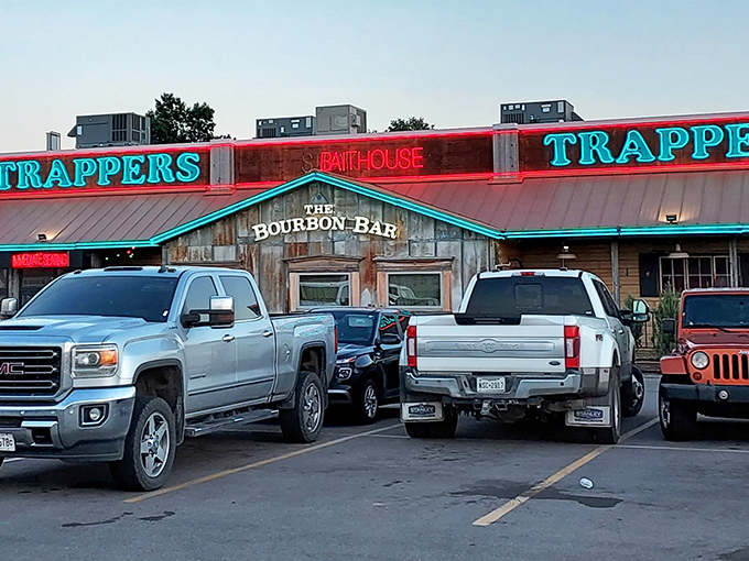 The neon glow of Trapper's beckons hungry travelers like a lighthouse for landlocked seafood lovers. Pickup trucks in the lot suggest you've found a true Oklahoma favorite.