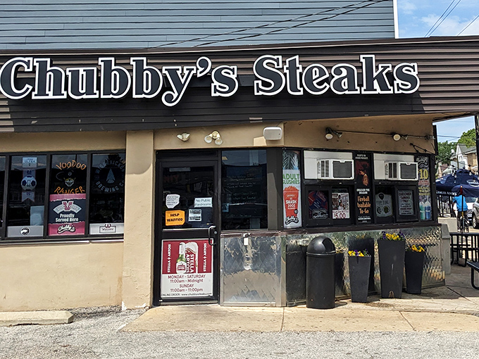 The holy temple of cheesesteak worship stands unassuming on Henry Avenue, its neon sign a beacon to sandwich pilgrims seeking meaty salvation.